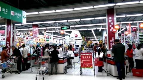 People line up a long queue and checkout... | Stock Video | Pond5