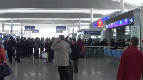 People line up a long queue and get in t... | Stock Video | Pond5