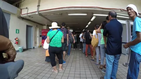 People line in queue for train ticket | Stock Video | Pond5