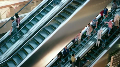 People move on escalator staircases insi... | Stock Video | Pond5