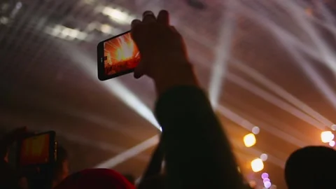 People at a music concert jump and wave ... | Stock Video | Pond5