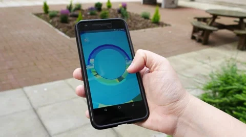 People playing "Pokemon GO" the hit augm... | Stock Video | Pond5