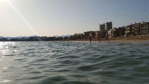 People relaxing on Palma city beach. Sum... | Stock Video | Pond5