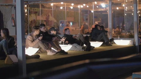 People relaxing in rooftop restaurant Az... | Stock Video | Pond5