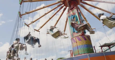 People ride elevated swings at Atlanta D... | Stock Video | Pond5