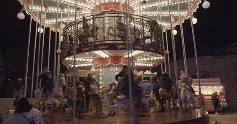 People Riding Carousel at Night in Winte... | Stock Video | Pond5