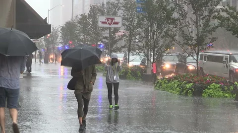 People running for cover in heavy rain w... | Stock Video | Pond5