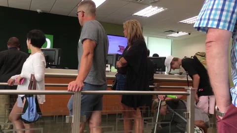 People at the service counter talking to... | Stock Video | Pond5