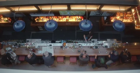People sitting at the bar, Phones, Newsp... | Stock Video | Pond5