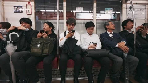 People sitting inside the train in Tokyo | Stock Video | Pond5