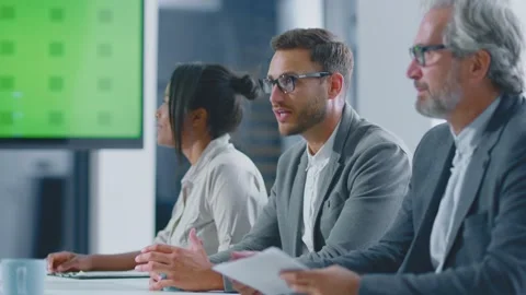 People sitting on one row at table | Stock Video | Pond5