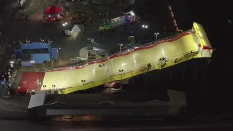 People Sliding On A Giant Slide At Night... | Stock Video | Pond5