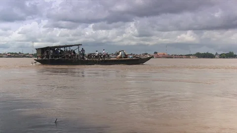 People in a small ferry boat crossing a ... | Stock Video | Pond5