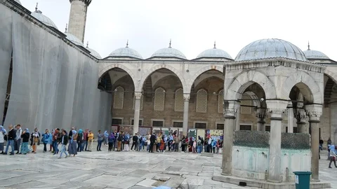 People standing at courtyard in queue li... | Stock Video | Pond5