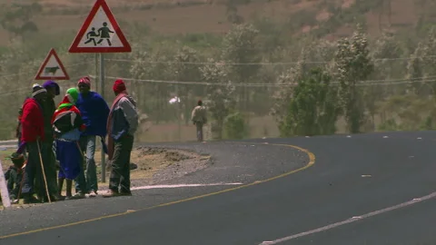 People standing on roadside, person on m... | Stock Video | Pond5