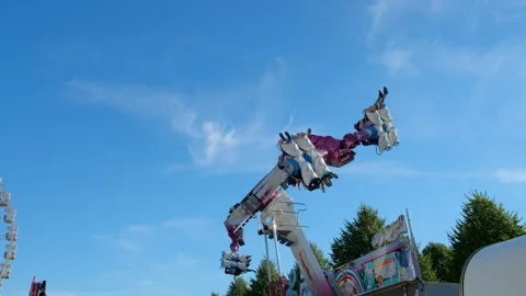 People swinging on an extreme spinning a... | Stock Video | Pond5