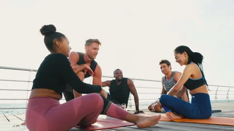 People take break from yoga session to d... | Stock Video | Pond5