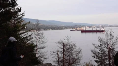 People take photos from cliff of cargo s... | Stock Video | Pond5