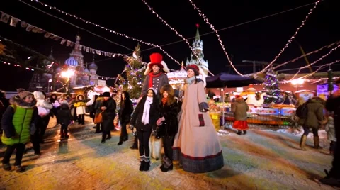 People take photos with stilt-walkers dr... | Stock Video | Pond5