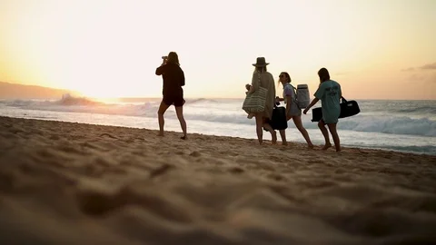People Taking a Long Walk on the Beach a... | Stock Video | Pond5