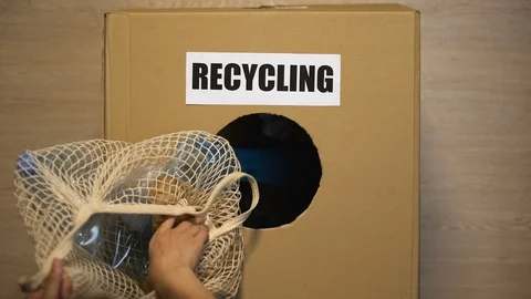 People throwing plastic waste into box f... | Stock Video | Pond5