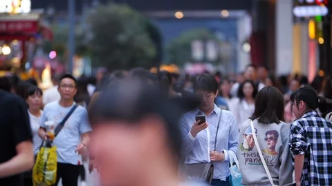 People using mobile phone in busy street | Stock Video | Pond5