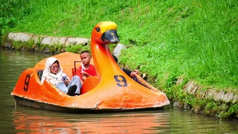 People on vacation riding water duck rec... | Stock Video | Pond5