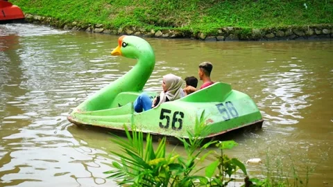 People on vacation riding water duck rec... | Stock Video | Pond5