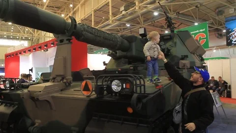 People view a weapon on the demonstratio... | Stock Video | Pond5