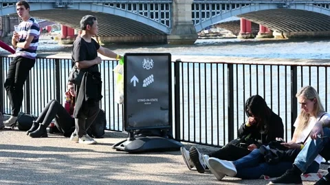 People waiting in queue along South Bank... | Stock Video | Pond5