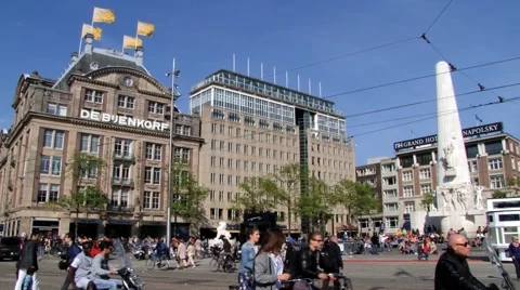 People walk by the dam square in Amsterd... | Stock Video | Pond5