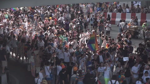 People walk in a parade to kick off Bang... | Stock Video | Pond5