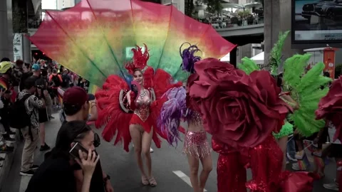 People walk in a parade to kick off Bang... | Stock Video | Pond5