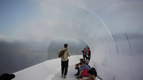 People walk in plastic bubble art instal... | Stock Video | Pond5