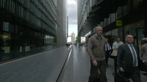 People walking between the modern buildi... | Stock Video | Pond5