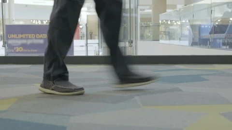 people walking by the camera inside the ... | Stock Video | Pond5