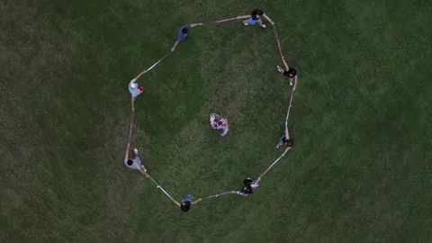 People Walking in Circle Holding Hands A... | Stock Video | Pond5