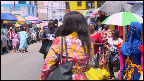 People walking at noon in a commercial s... | Stock Video | Pond5