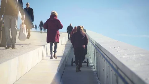 People walking up a ramp at Oslo's Opera... | Stock Video | Pond5