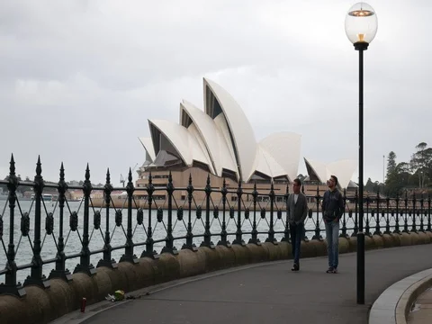 People walking with the Sydney opera hou... | Stock Video | Pond5