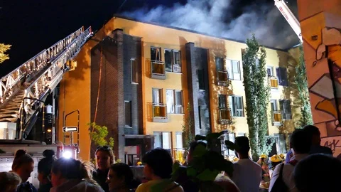 People watching structure fire | Stock Video | Pond5