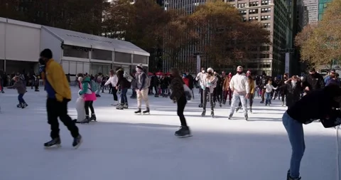 People Wearing Masks Ice-Skating on Ice-... | Stock Video | Pond5