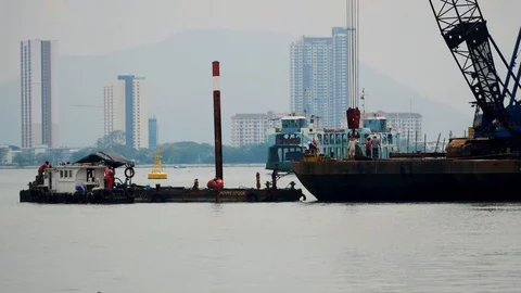People work at ship with background ferr... | Stock Video | Pond5