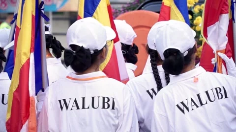 Peoples wearing WALUBI shirt are holding... | Stock Video | Pond5
