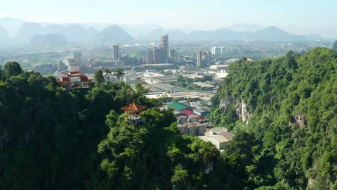 Perak Cave Temple, factories and limesto... | Stock Video | Pond5
