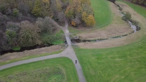 A person arriving to a bridge that cross... | Stock Video | Pond5