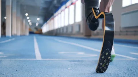 Person with bionic prosthesis running on... | Stock Video | Pond5
