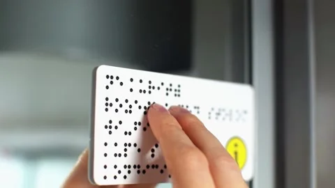 Person with blindness touches the Braill... | Stock Video | Pond5