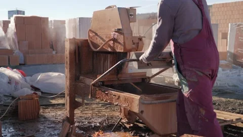 person is building a house at a construc... | Stock Video | Pond5