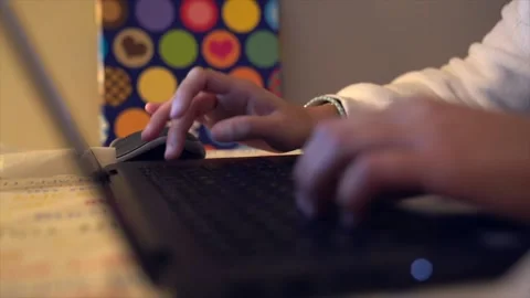 Person clicking a mouse and typing on a ... | Stock Video | Pond5